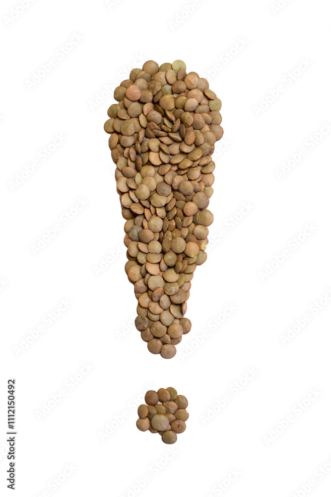 Exclamation mark made of green lentils on a white background. The ...