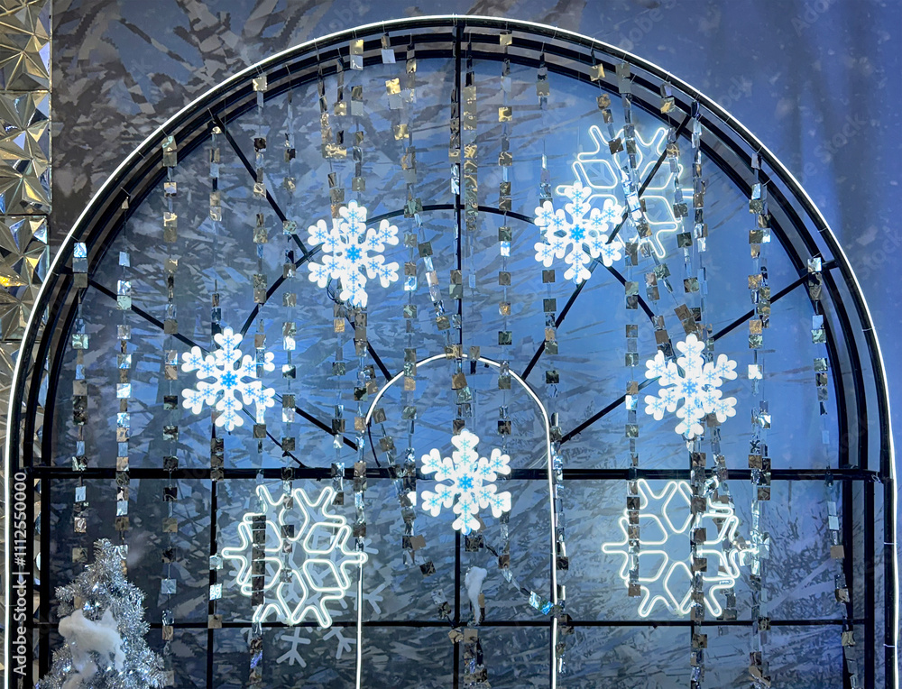 Christmas decoration with arched window trellis and white lighted snow ...