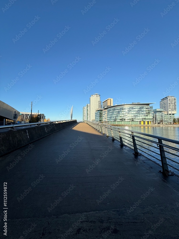 Poster Modern buildings and landmarks next to the water with a clear ...