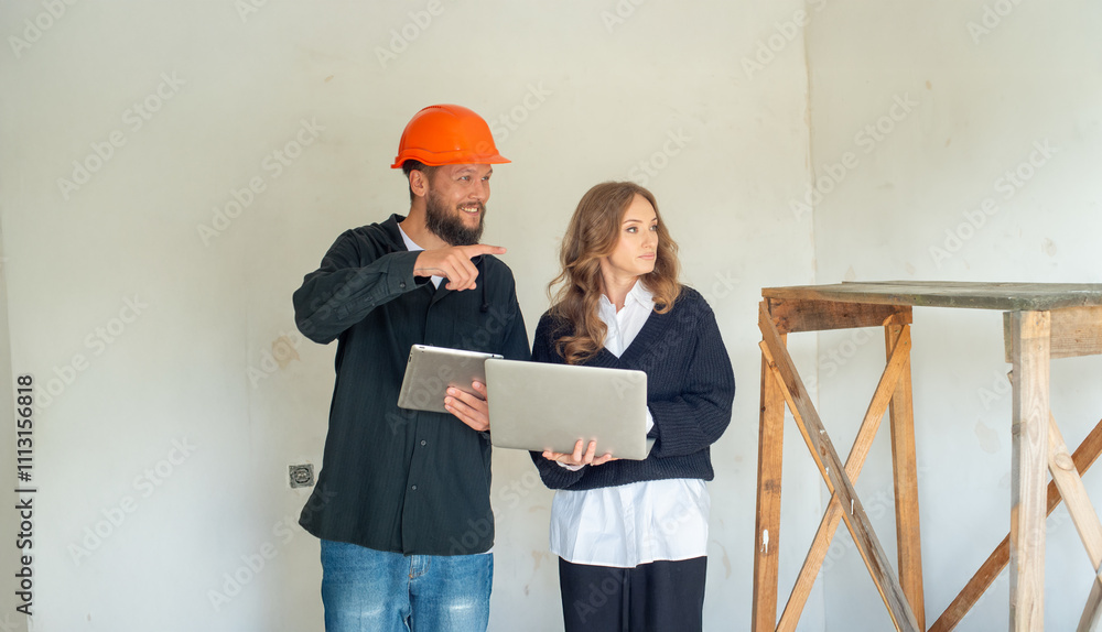 architect and foreman at an unfinished site. customer architect and ...