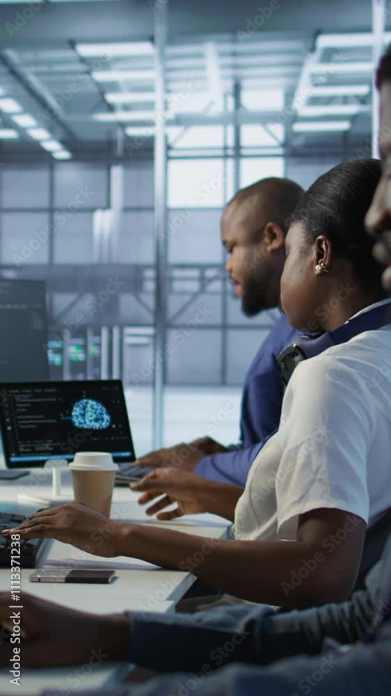 Vertical video Admin in data center drinking coffee and implementing AI predictive maintenance ...