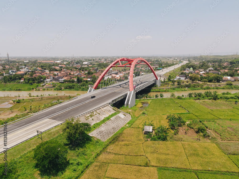 Plakát Aerial drone photography of a bridge named Jembatan Kalikuto in ...