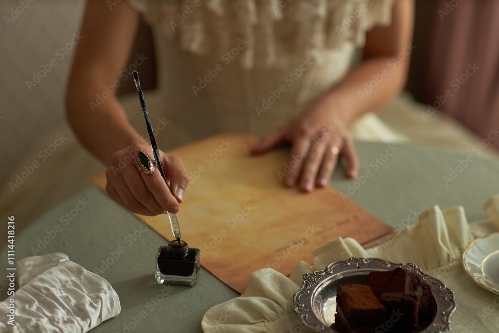 Poster Top view closeup of lady writing letter with female hand dipping ...
