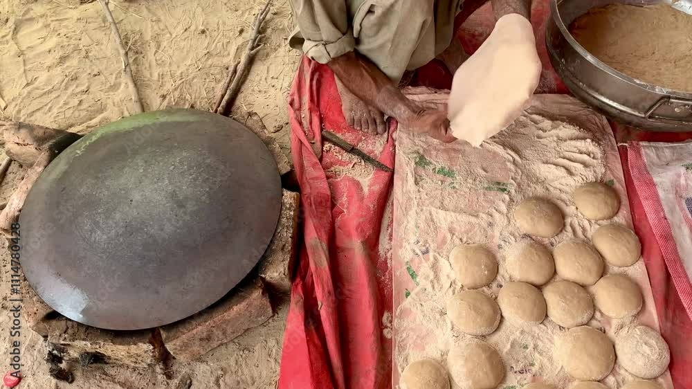 Close up of hands of an Asian male making roti in the kitchen. Concept ...