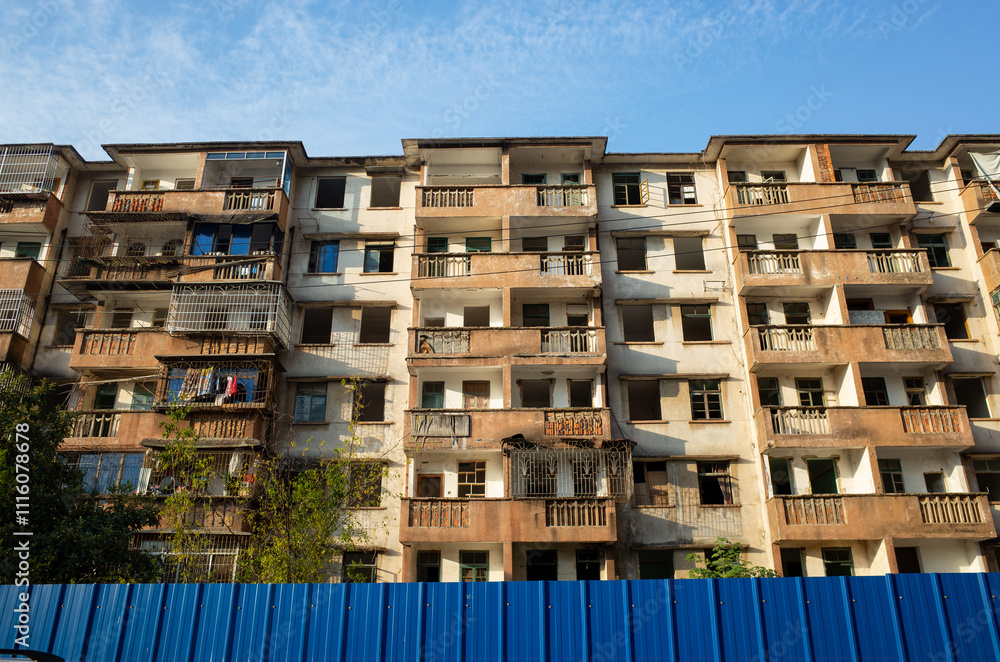 a decaying and old apartment building in Liuzhou, China, partially ...