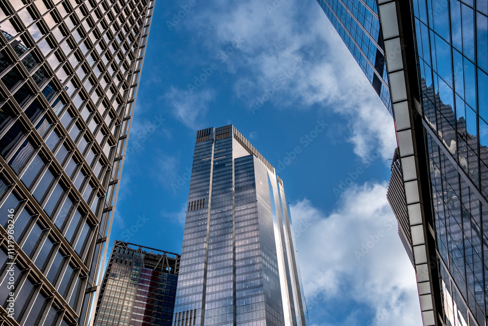 The dramatic view of a triangular glass tower framed by sleek ...