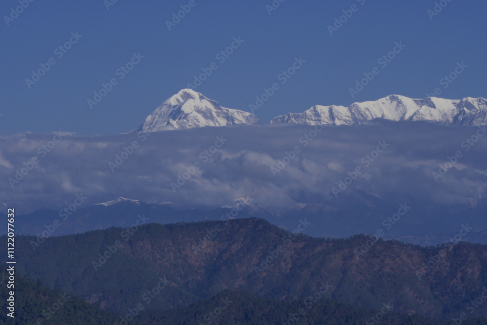 Snow covered Himalayan peaks including Mt.Trishul and Nanda Devi rise ...