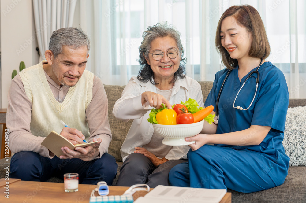 visiting nurse holding bowl of vegetables,giving advice asian senior ...