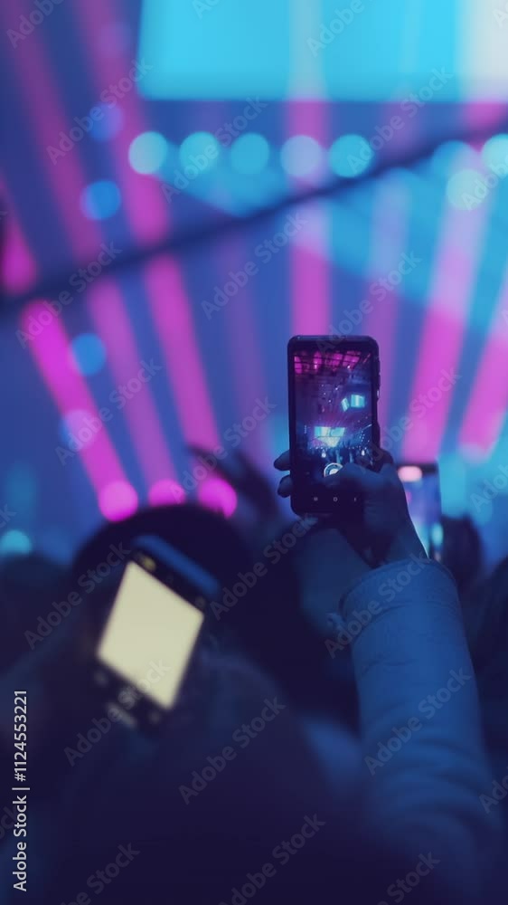 Vertical video: Exciting concert performance captured by fans at night ...