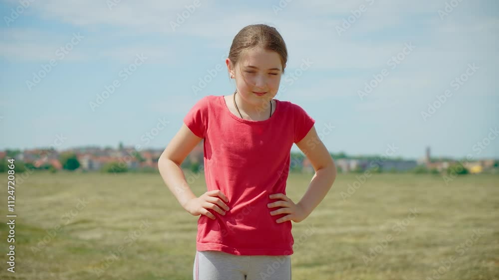 Young cute girl stretching before outdoor gymnastics. Female warming up ...