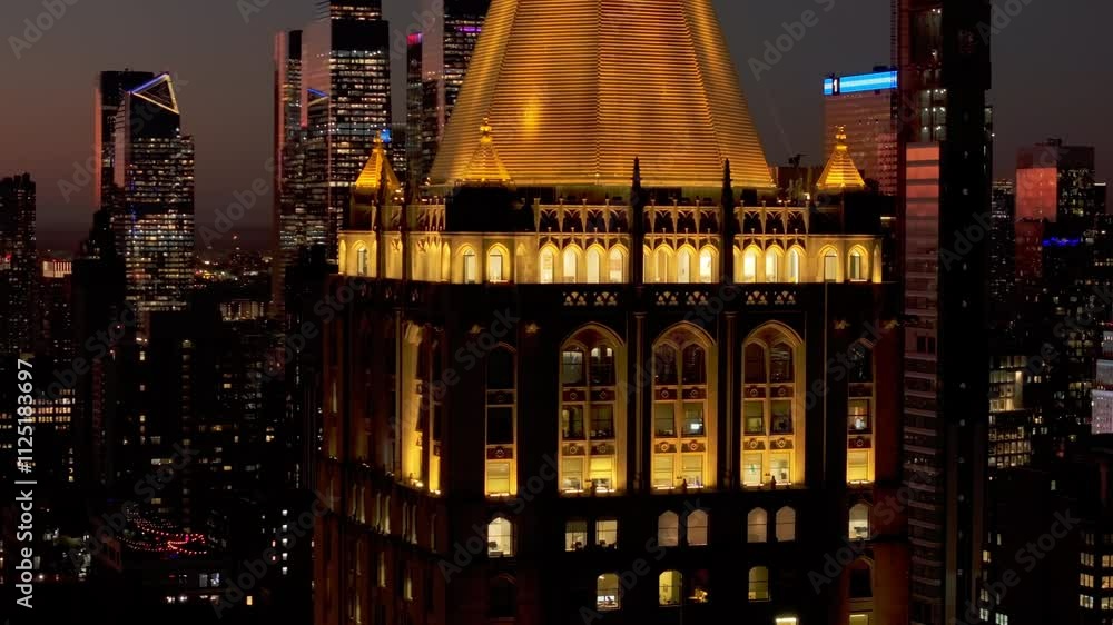 Golden light bathes New York Life Building art deco skyscraper in ...