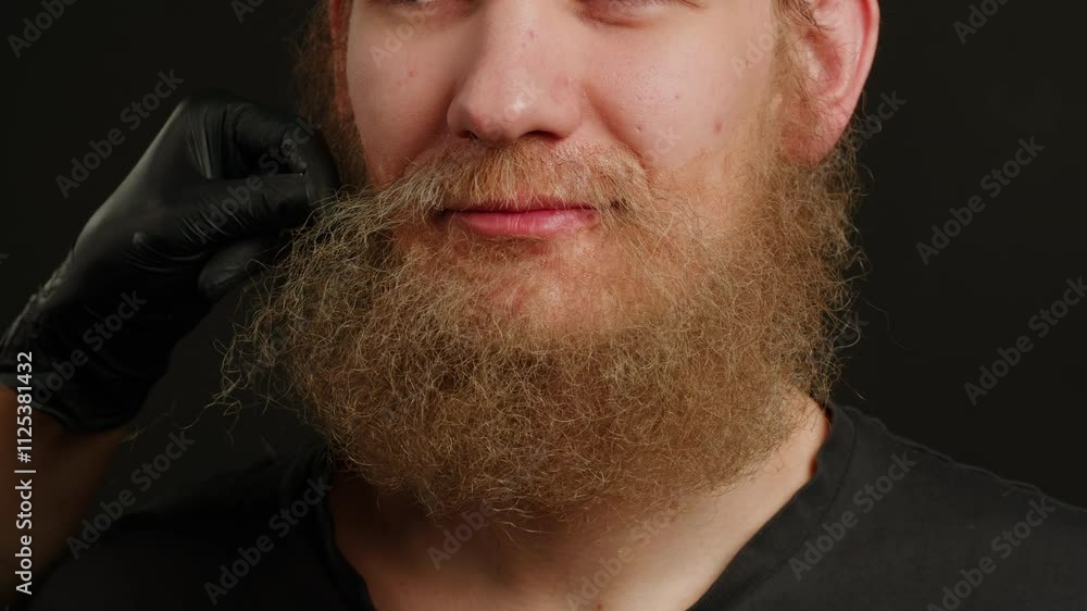 Make up artist making Disheveled blond beard for a man in theater with ...