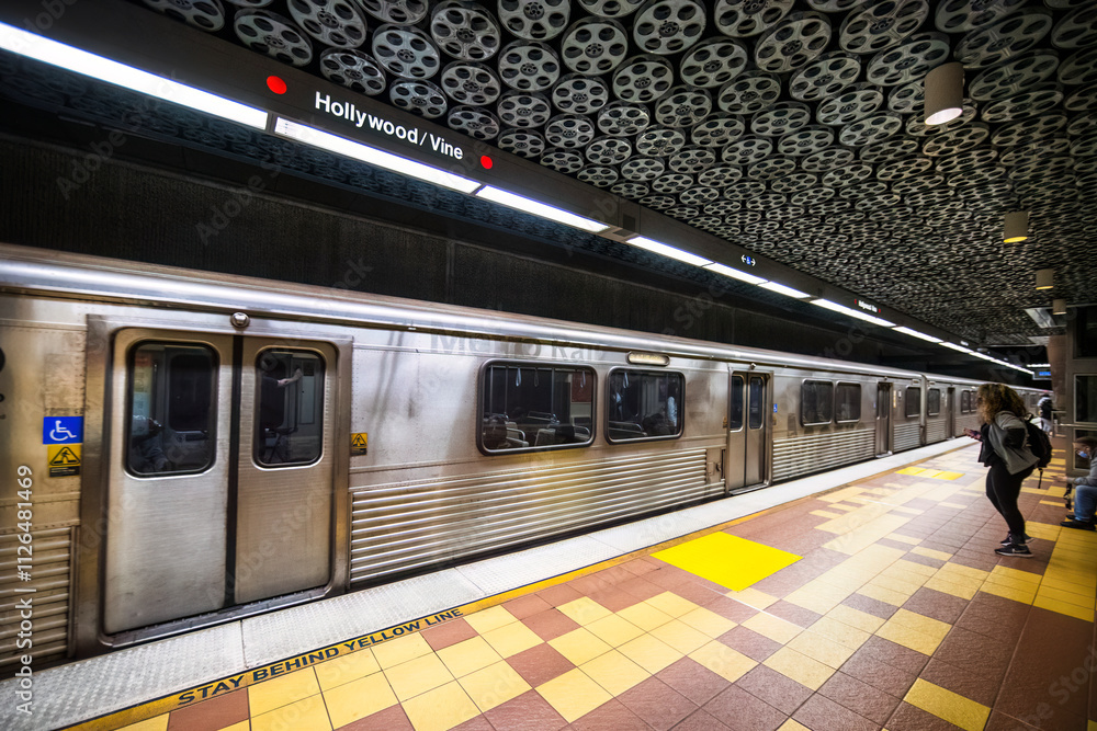 Los Angeles Metro train at Hollywood Vine station, with film reel ...