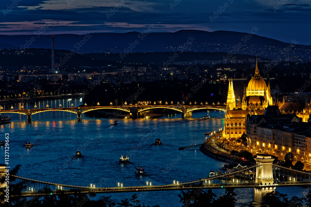 Stunning night view of Budapest featuring the illuminated Parliament ...
