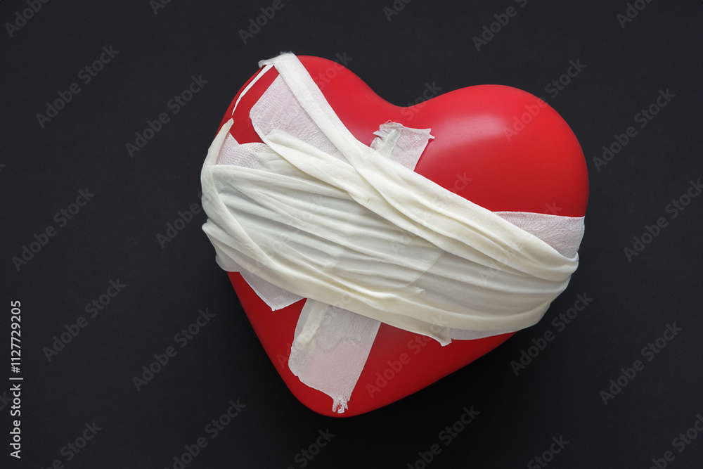 Red heart with tape wrapped around it. Black and white heart with black ...