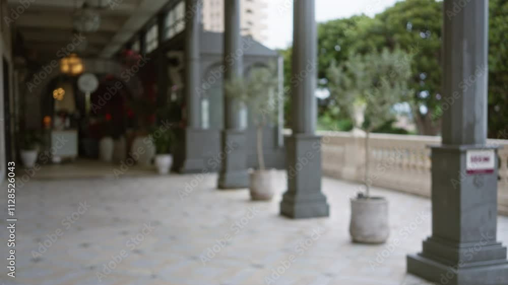 Blurry view of luxurious street in monaco with decorative columns and ...