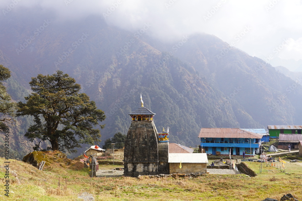 madhyamaheshwar temple surrounded by beautiful greenery and village ...