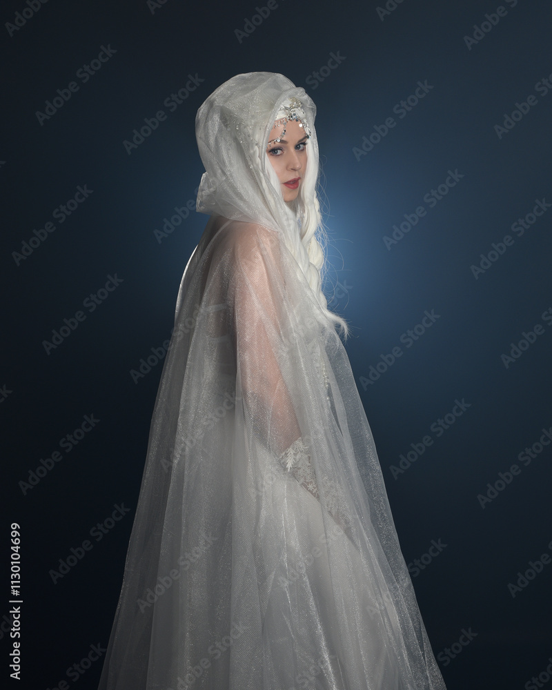 close up portrait of beautiful blonde female model wearing white ...