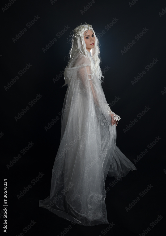 full length portrait of beautiful blonde female model wearing white ...