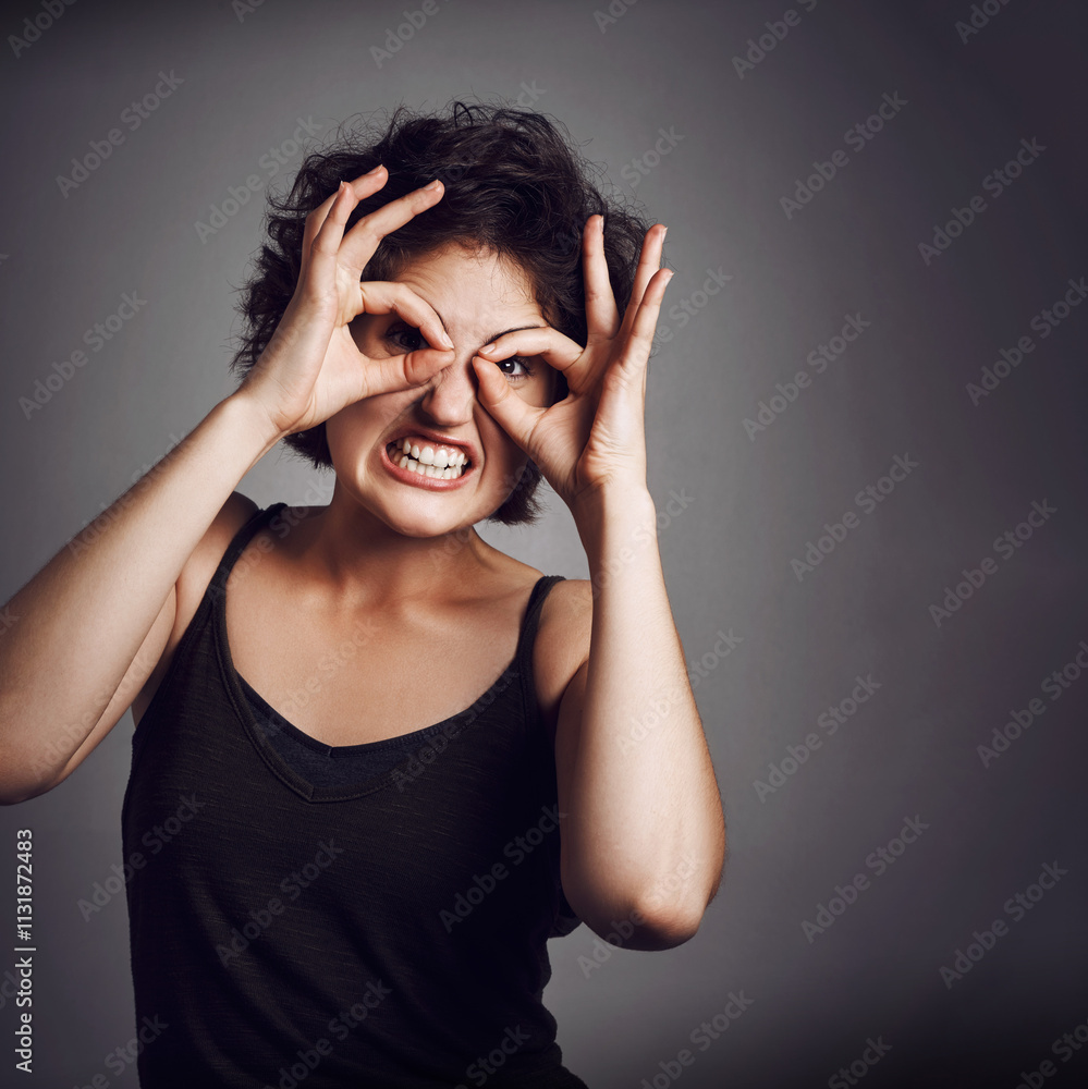 Circle on eyes, funny face and portrait of woman in studio for facial ...