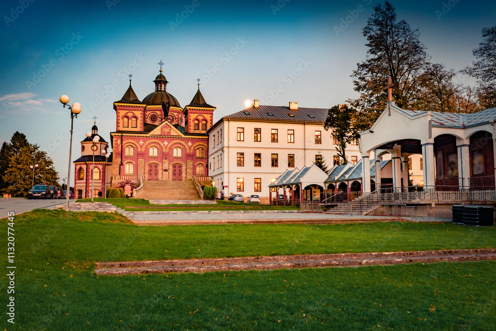 Adorable evening view of red brick Catholic Sanctuary of St. Michael ...