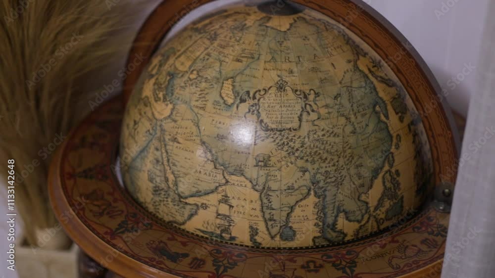 close up antique globe with old names history and geography of the earth beautiful brown globe ...