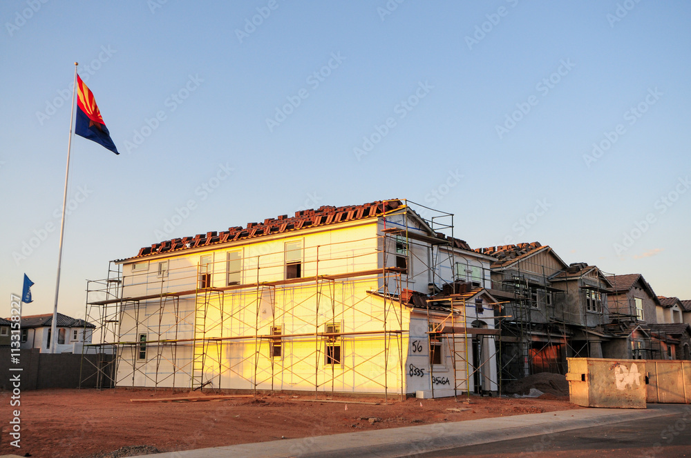 Two-story single-family homes at various stages of construction in a ...