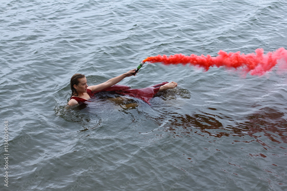 Abstract fashion portrait. Smoke under water. Young beautiful drowned ...