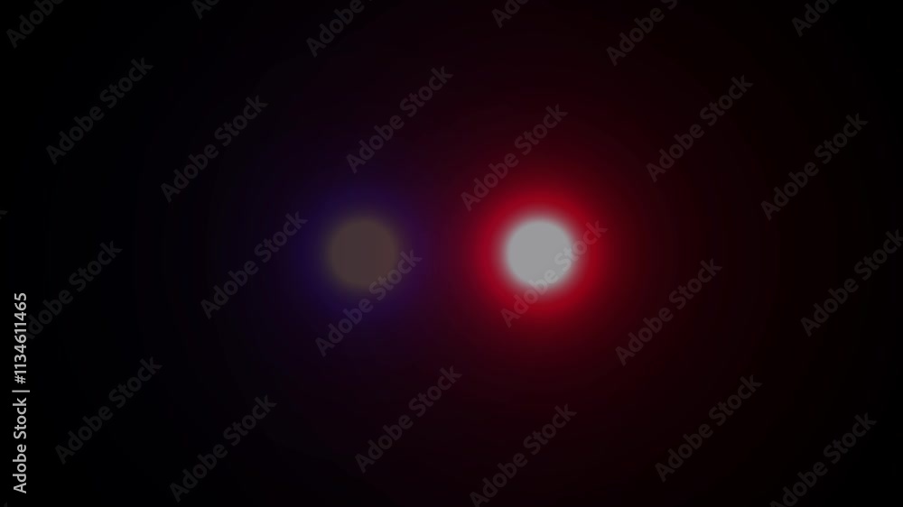Flashing strobe lights from an emergency vehicle defocused to create a ...