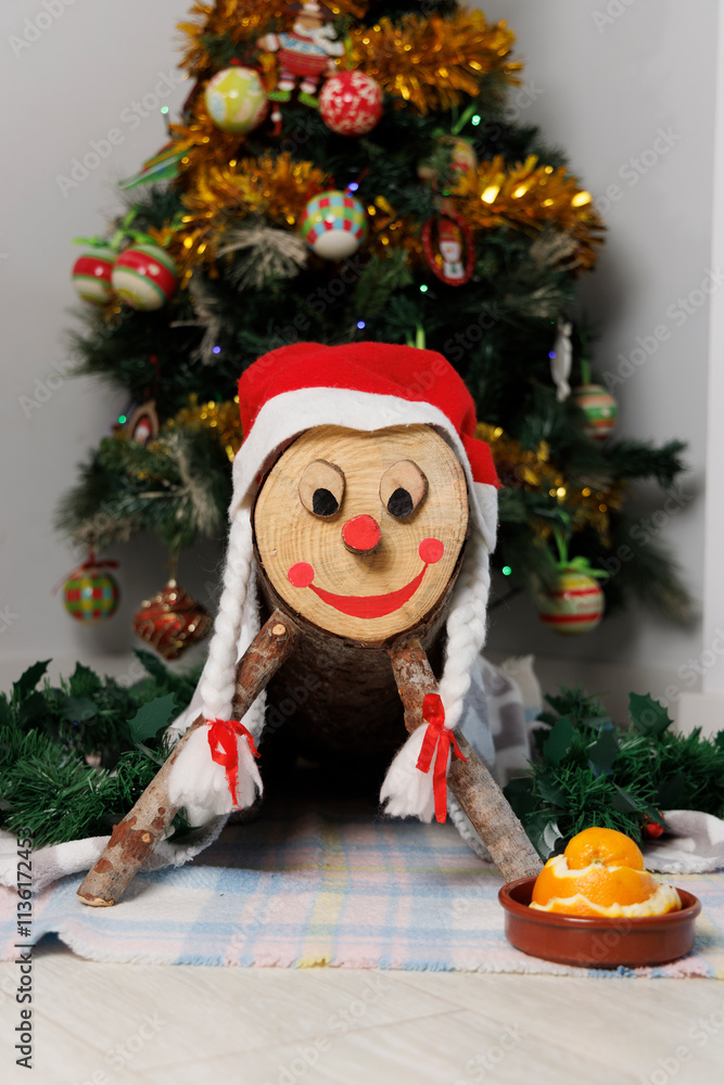 Tió de Nadal. A hollow log with a barretina, called Tió, is a Catalan ...