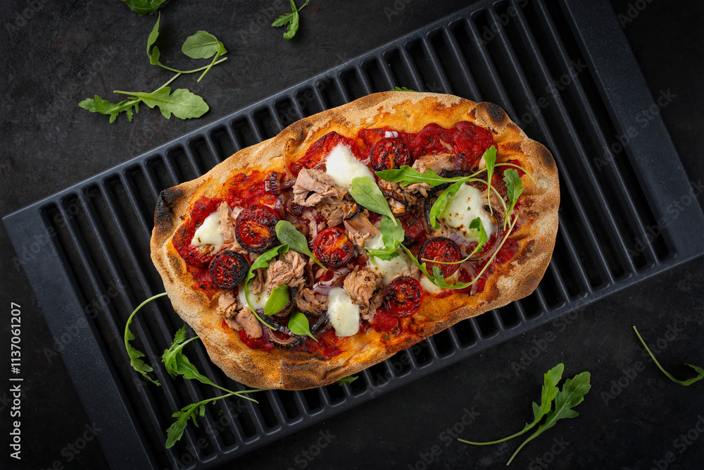 Traditional Italian pinsa bread prosciutto e salsa di pomodoro with ...