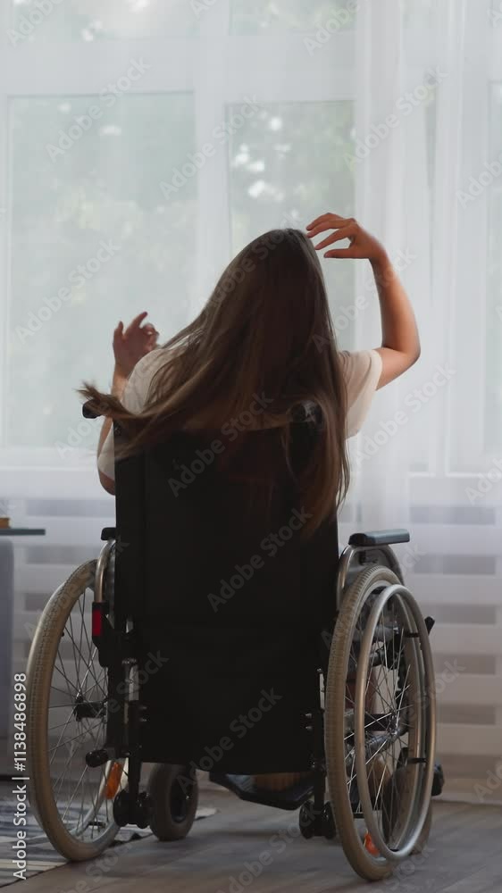 Lonely lady with disability with multiple sclerosis looks out bright ...