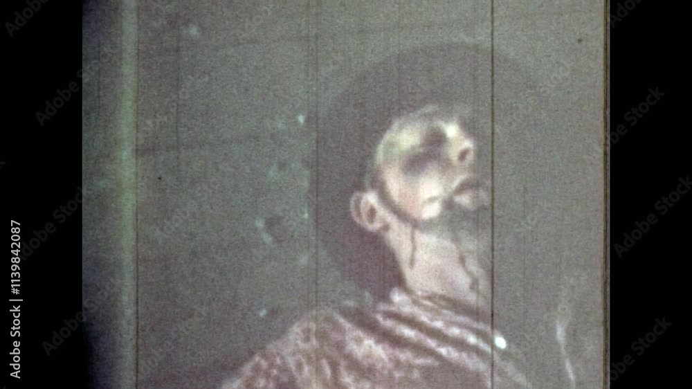 Beaten man face portrait in brick room, close up. Cowboy lying ...