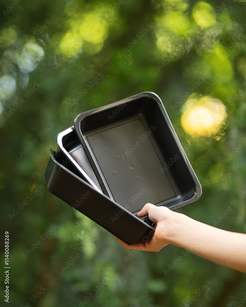 Baking dishes, molds. Plastic black empty containers for food storage ...