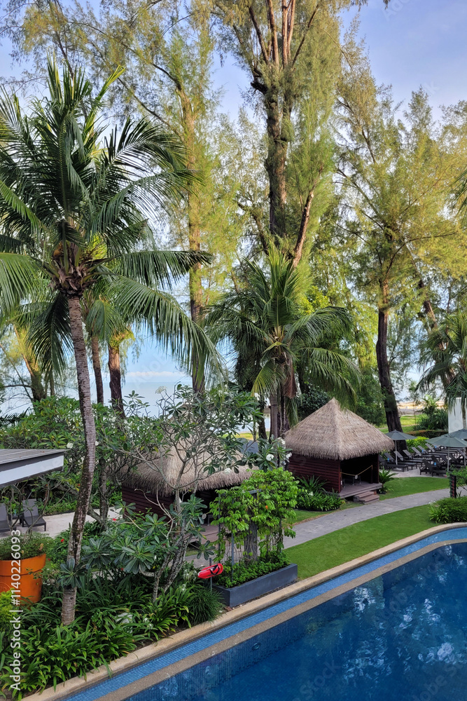 Penang, Malaysia - Dec 15, 2024: A serene tropical view of the poolside ...