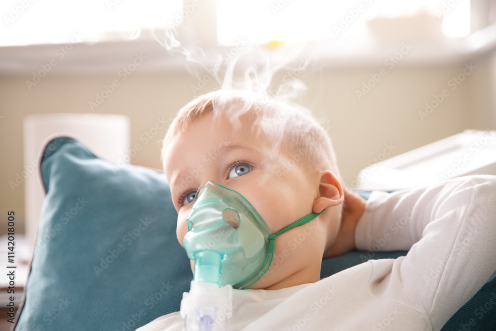 Cute little kid boy wear use medical nebulizer mask inhaling steam ...