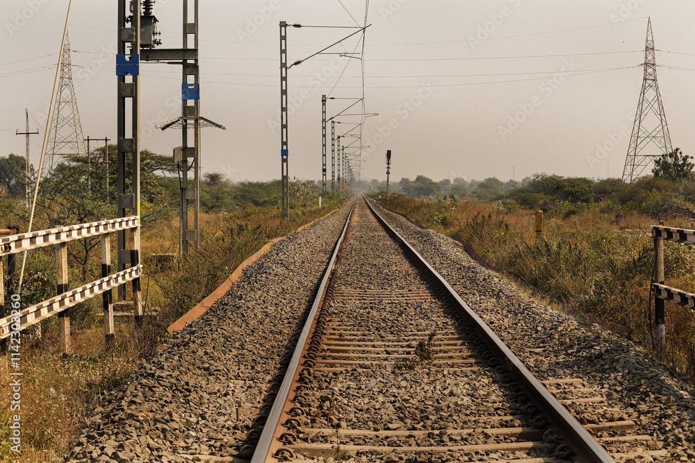 Empty railway track under sky. A railway track or railroad track, is ...