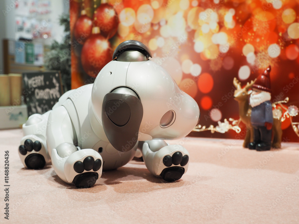 TOKYO, JAPAN - December 21, 2024: A Sony Aibo robot dog on a Christmas ...