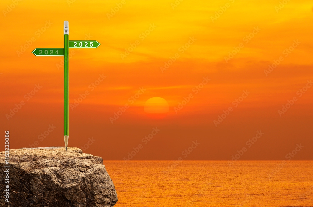 2025 and 2024 direction sign plate with green pencil on rock mountain ...