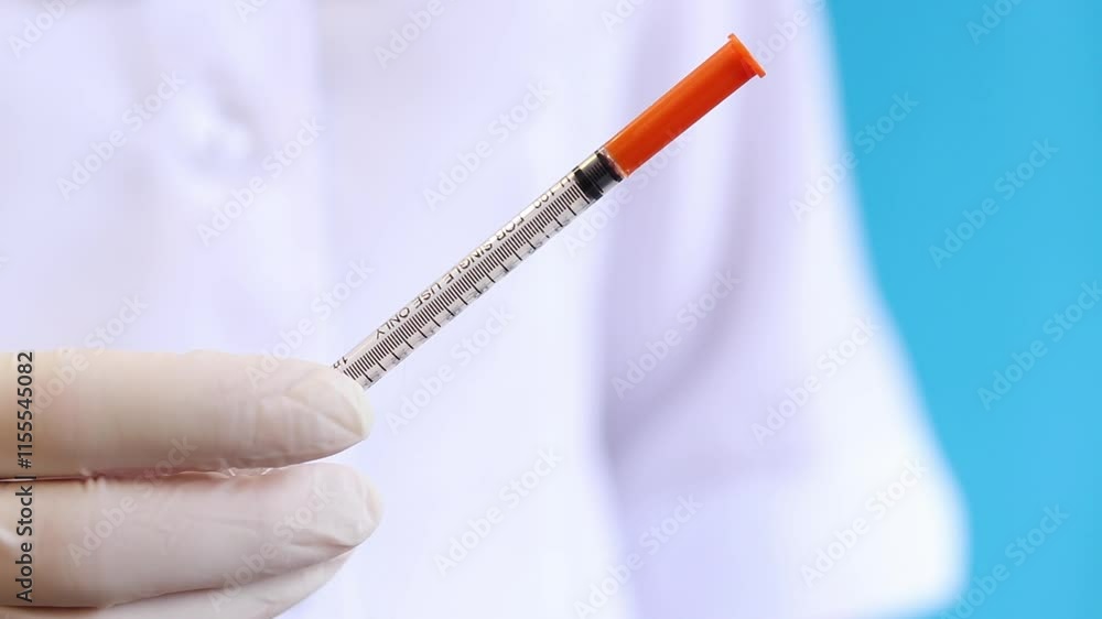 Insulin syringe. Nurse or doctor with syringe. Female hand in gloves ...