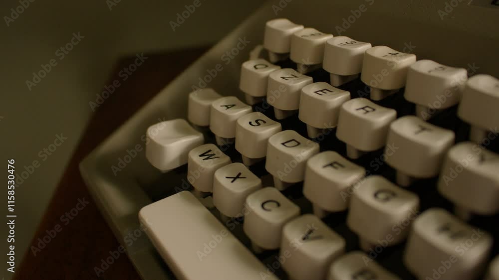 Close-up of a vintage typewriter keyboard with white keys featuring ...