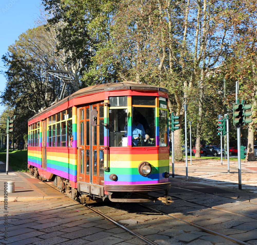 electric tram on rails in vintage style colored with rainbow colors in ...