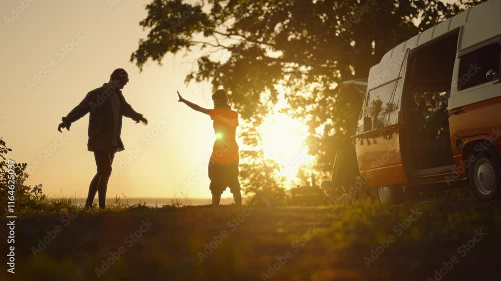 Romantic weekend in nature, young married couple dancing against sunset ...