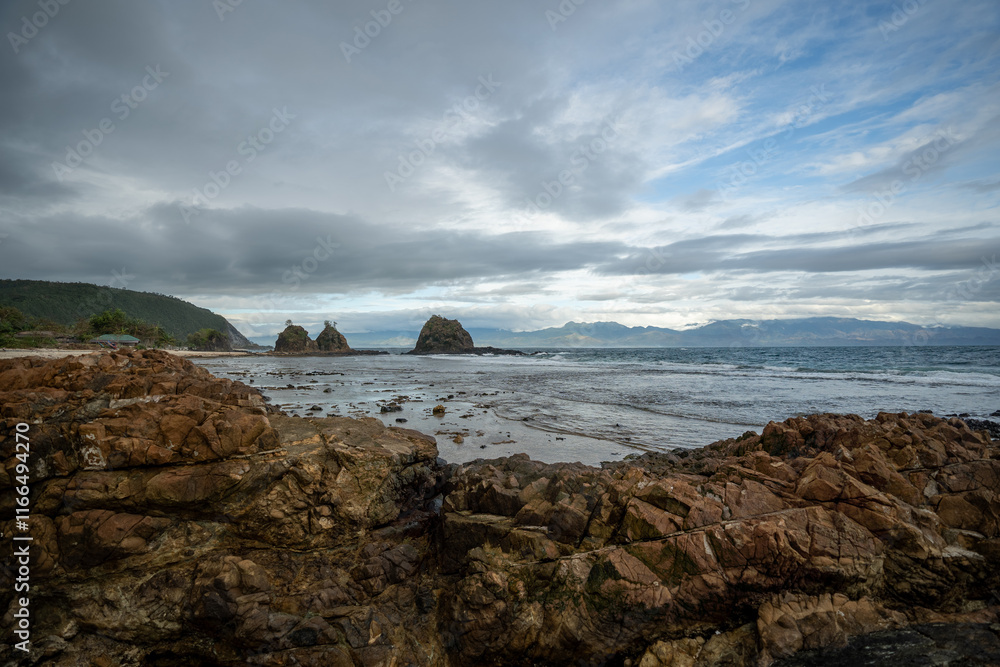 Poster Diguisit Beach in Baler, Philippines features a rugged coastline ...