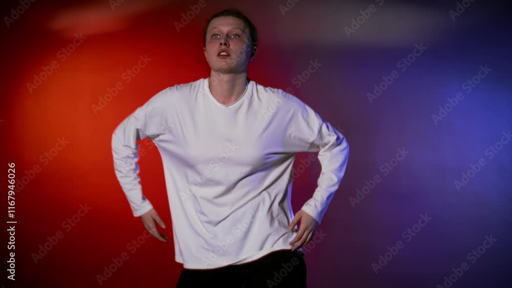 Energy and motion, female dancer moving actively in studio, red and ...