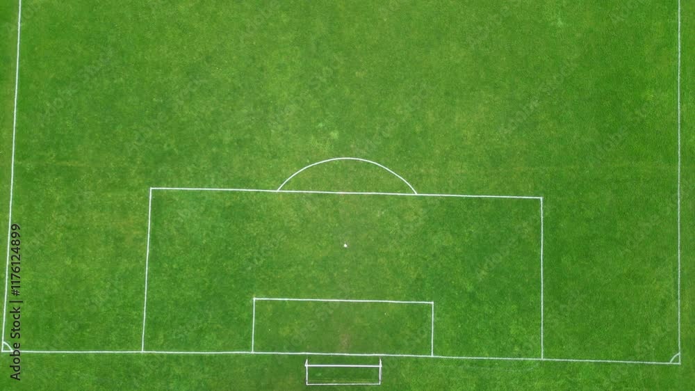 A 4K bird's eye view of a football field, showcasing the full layout of ...