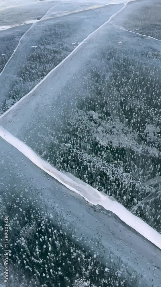 Vertical video of beautiful ice texture. Cold blue ice background with ...