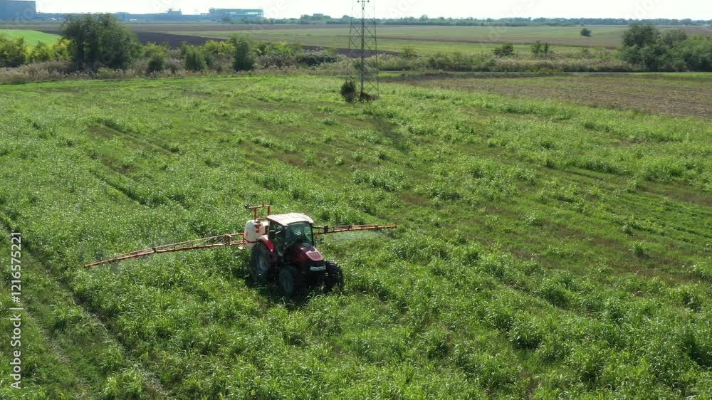 Above view, dolly move orbit around tractor until spraying farmland ...
