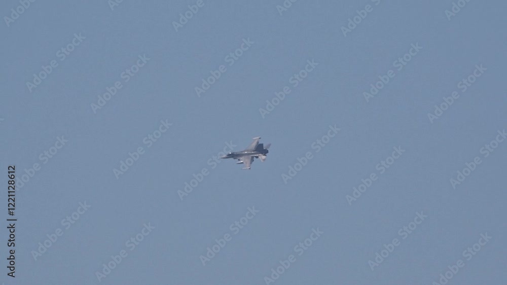 fighter jet making right turn descent to strike target during military ...