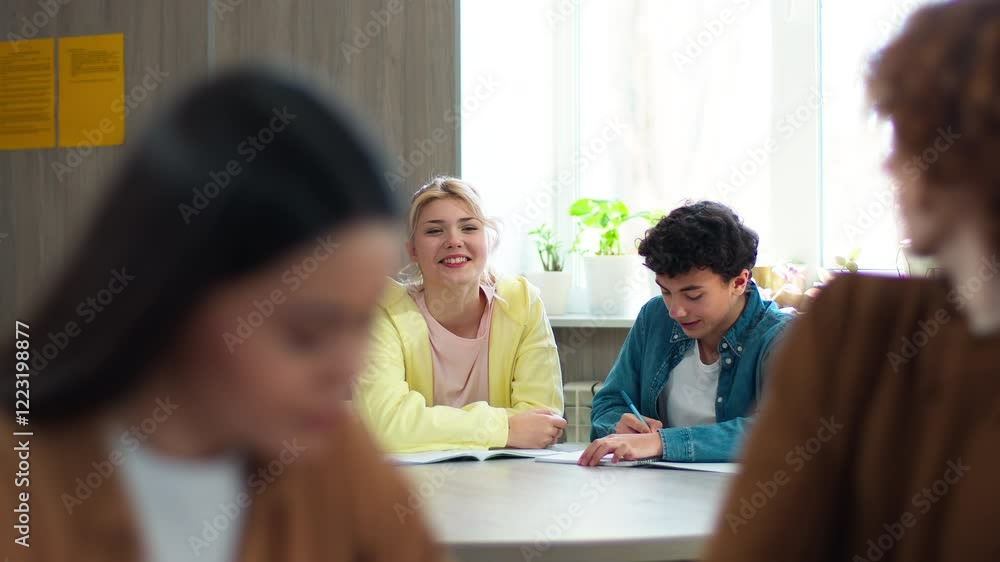 Four school mates students pupils studying in class lesson blurry man ...